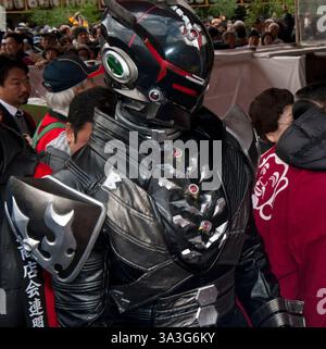 Japanese super hero cosplay fantasy in helmet and costume appears at an ...
