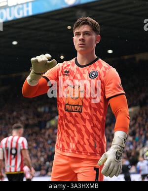 Sheffield United goalkeeper Michael Cooper makes a save from the shot ...
