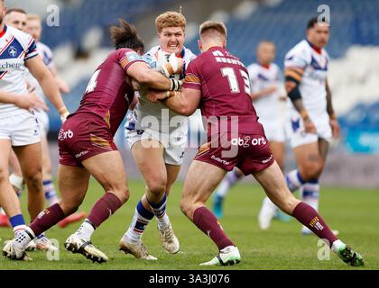 Wakefield Trinity's Caius Faatili tackled by Wigan Warriors' Liam ...