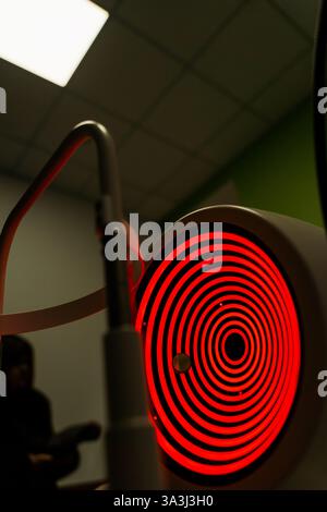 Corneal topographer shines red light for topography examination ...