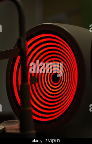 Corneal topographer shines red light for topography examination ...