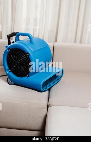 Process of drying sofa using floor dryer blower fan machine. Floor ...