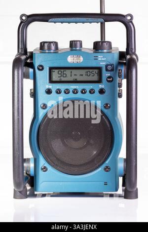 Compact blue radio with visible controls, durable build, and front ...