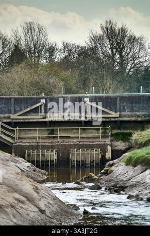Closed sluice gates at low tide Stock Photo - Alamy