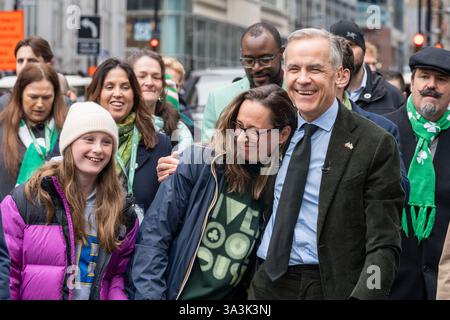 Prime Minister Mark Carney, right, and Ontario Premier Doug Ford hold a ...