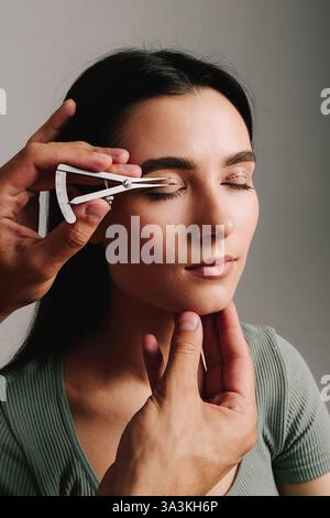 Blepharoplasty marking up. Plastic surgeon is measuring distance in ...