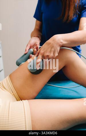 Tecar therapy to help with post surgery rehabilitation. Young athlete ...