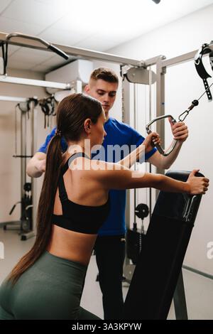Female patient is doing kinesitherapy yo improve physical conditioning ...