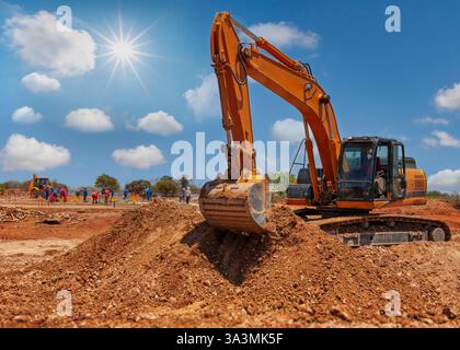 A excavator is digging on outdoors in an industrial site. Excavation ...