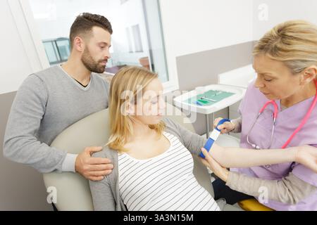 pregnant woman getting her pulse checked Stock Photo - Alamy