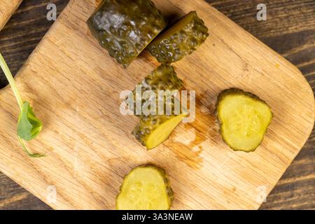 cut cucumbers marinated with salt and spices, pickled cucumbers during ...