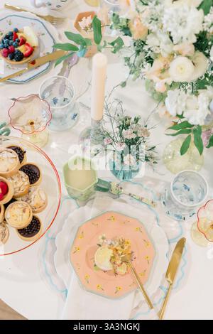 Elegant spring table setting with delicate muscari flowers. Selective ...