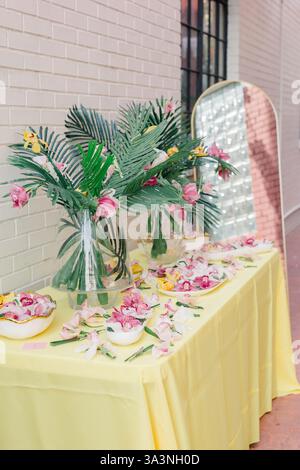 Vibrant yellow orchids and soft pink blossoms arranged in a colorful ...