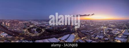 Panoramic aerial view of Leeds at dawn, highlighting the city's skyline ...