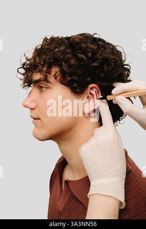 ENT doctor drawing mark up lines before plastic surgery for reshaping ...