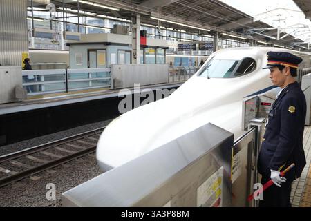 Bullet train and conductor in uniform, Kyoto station, Japan, Asia Stock ...