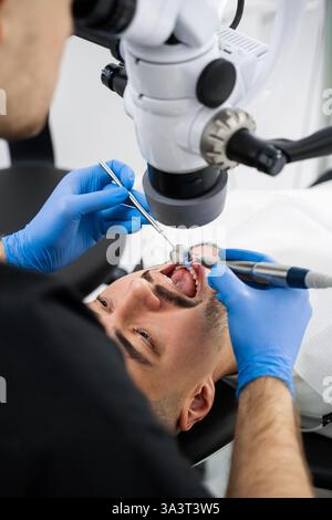 Polishing teeth with digital microscope in stomatology clinic. Digital ...