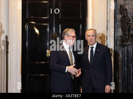 London, UK. 17th March 2025. Posters depicting Donald Trump, Elon Musk ...