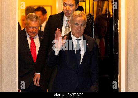 Prime Minister Mark Carney leaves following a signing ceremony at ...