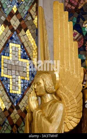 The statue of an angel in adoration Stock Photo - Alamy