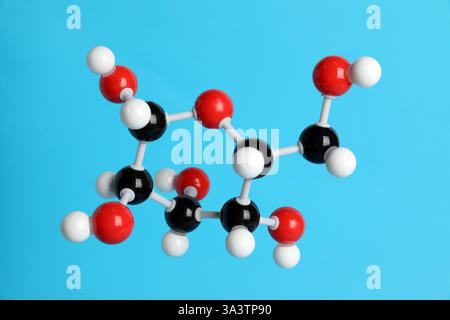 Molecule of glucose on light blue background. Chemical model Stock ...