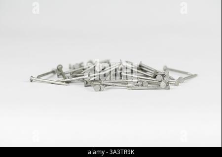 Pile of flat head galvanized steel nails close up Stock Photo - Alamy