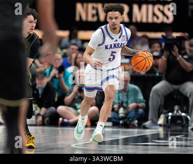 MAR 12 2025: Kansas Jayhawks guard Dajuan Harris Jr. (3) fights through ...