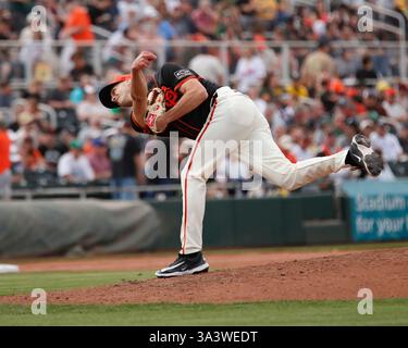 San Francisco Giants pitcher Tyler Rogers throws to a Los Angeles Dodgers batter during the ...