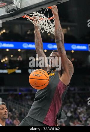 Missouri center Shawn Phillips Jr., right, is fouled by Arkansas ...