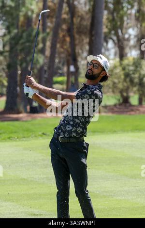 Akshay Bhatia hits on the first hole during the final round of the 3M Open golf tournament at ...