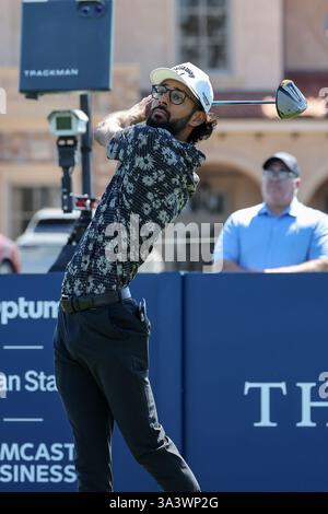 Akshay Bhatia hits on the first hole during the final round of the 3M Open golf tournament at ...