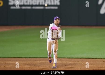 LSU Tigers shortstop Steven Milam (4) throws to first base during an ...