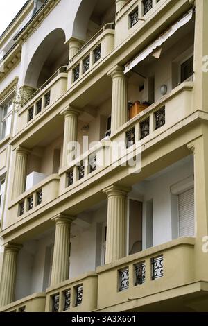 The front facade of a grand neoclassical building, featuring ...