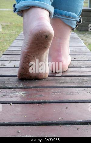 person celebrating go barefoot day by walking without shoes Stock Photo ...