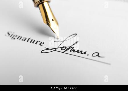 Pen leaving signature on contract, closeup view Stock Photo - Alamy