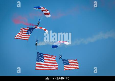 The Skydive Suffolk Demonstration Team carrying three American flags ...