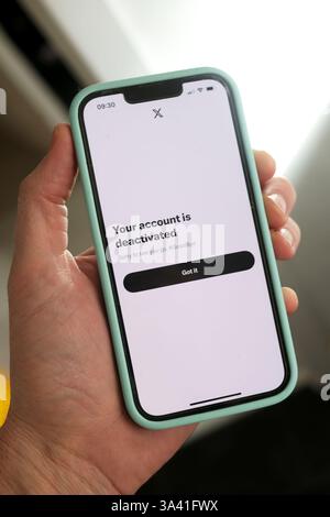 An iPhone with a deactivated X (Twitter) account on the screen pictured ...