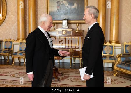 Jeroen Cooreman Ambassador from the Kingdom of Belgium (right) presents ...