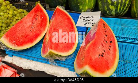 A closeup of grapes and watermelon slices in a buffet Stock Photo - Alamy