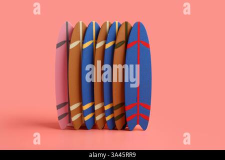 Different mini surfboards on pink background Stock Photo - Alamy