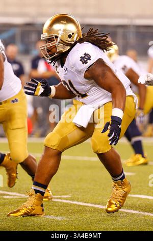 Notre Dame defensive lineman Christopher Burgess Jr. (33) covers a kick ...