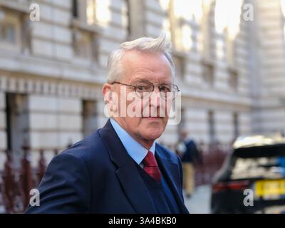 Northern Ireland Secretary Hilary Benn catches his footing on the cable ...