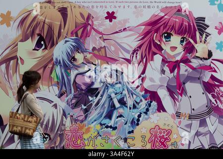 A person walks in front of an electronic stock board showing Japan's ...