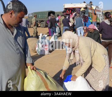 Kurdish refugees arrive in Yumurtalik, Turkey, fleeing the advances of ...