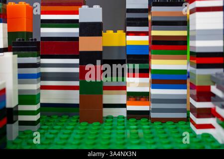 Tall building blocks towers background on green desk , abstract ...