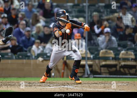 San Francisco Giants' Christian Koss, left, throws out Seattle Mariners ...