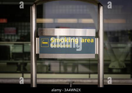 Smoking area zone sign and ashtray in one. Smoking area is outside of ...