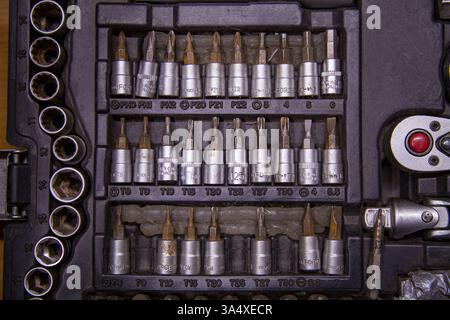 Set of bits and socket heads for automotive tools (Phillips, slotted ...