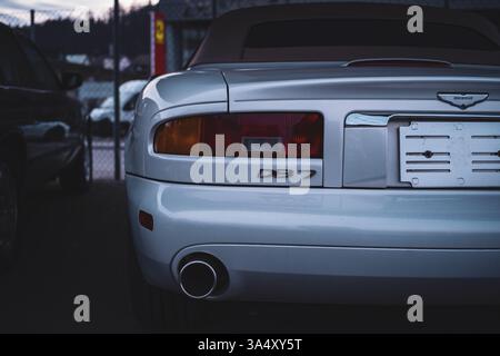 09-03-2025 Zurich, Switzerland. Aston Martin DB7 rear ornament emblem ...