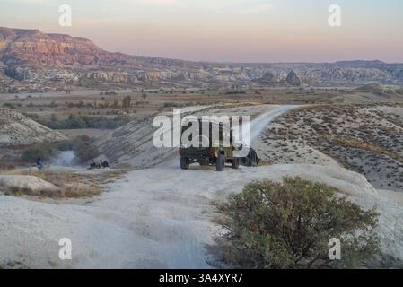 Offroad vehicled arriving at the group of phallic shaped fairy chimney ...
